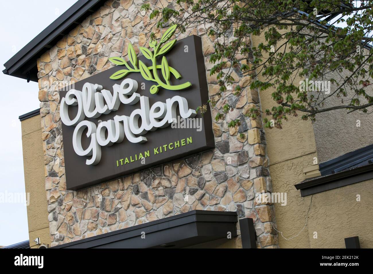 A logo sign outside of a Olive Garden restaurant location in Wilmington ...