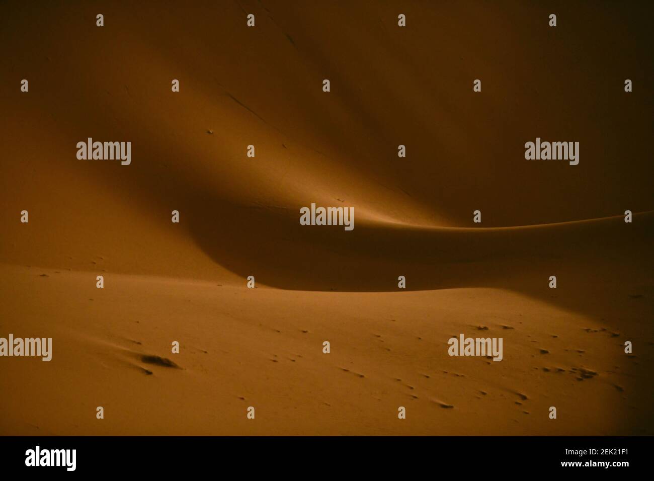 An aerial view of sunshine of the setting sun on the sand hills in the ...