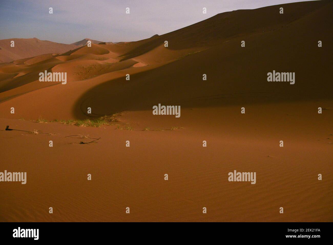 An aerial view of sunshine of the setting sun on the sand hills in the ...