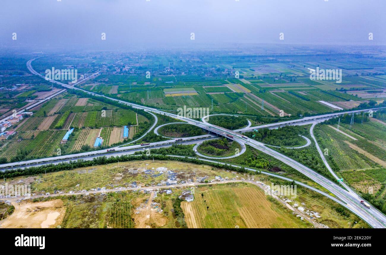 An aerial view of a complicated interchange linking different ...