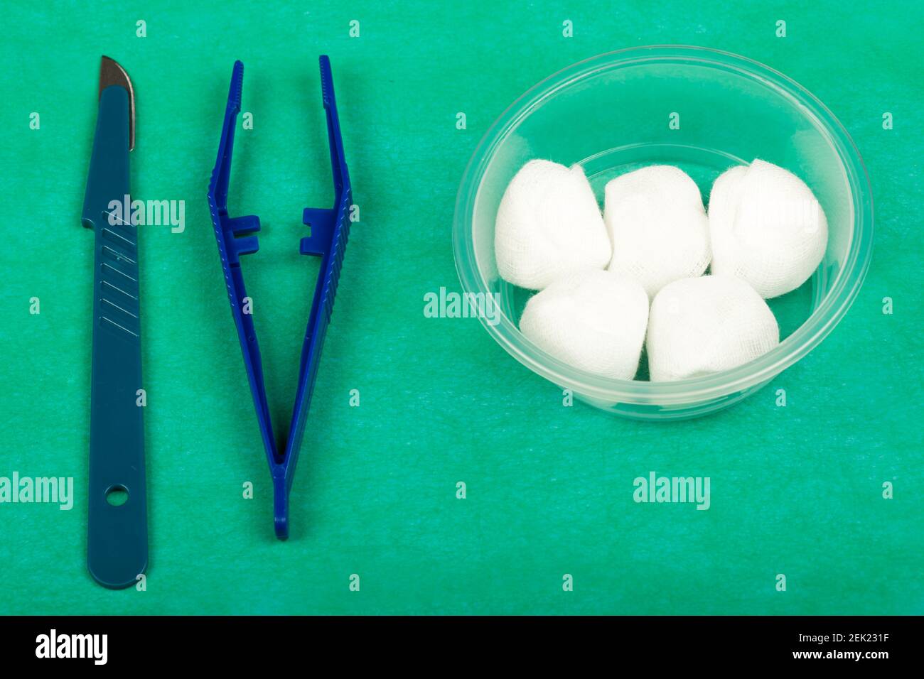Plastic surgical instruments on a green background Stock Photo - Alamy
