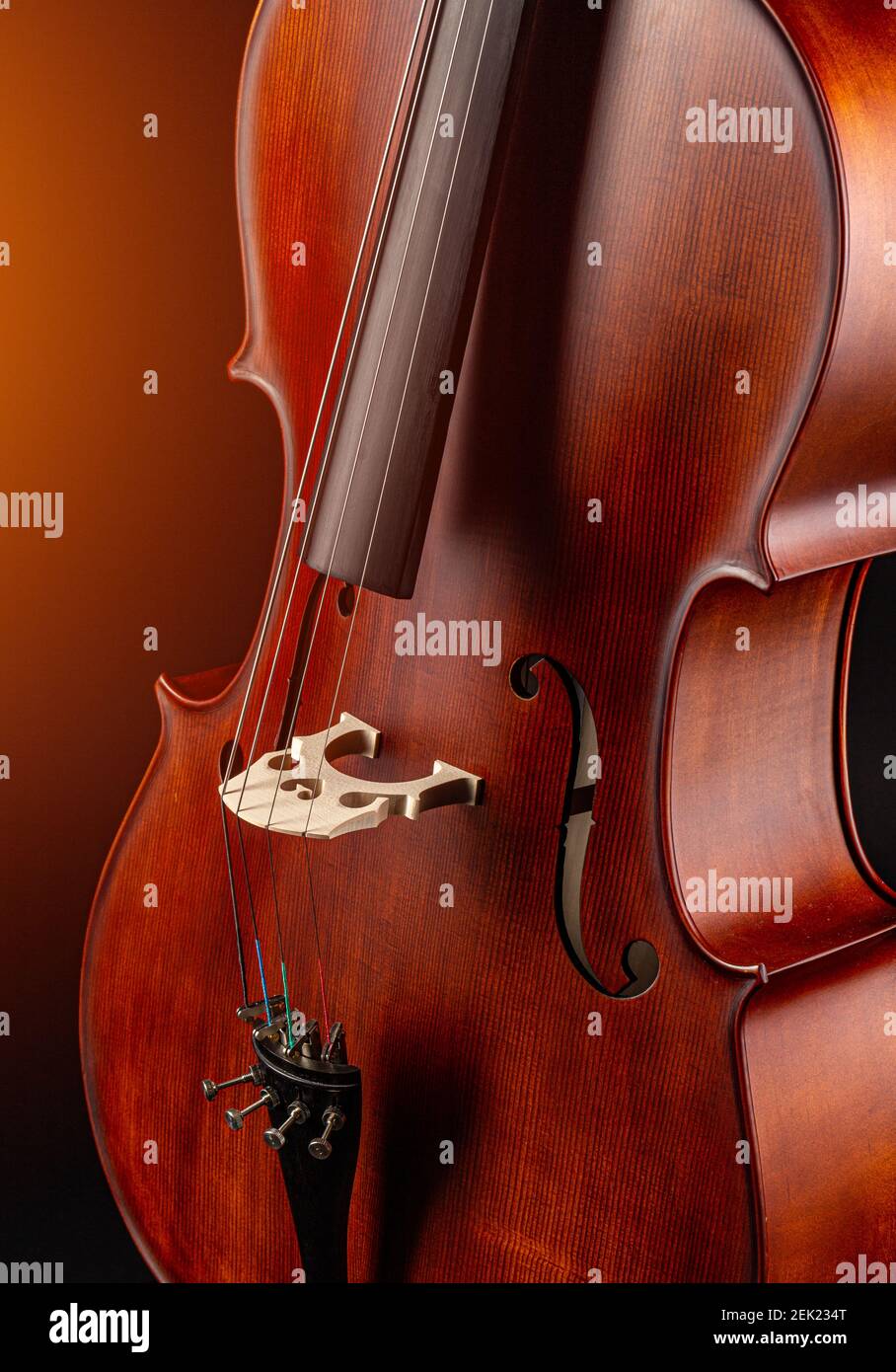 Classic stringed musical instrument, cello on dark background Stock ...