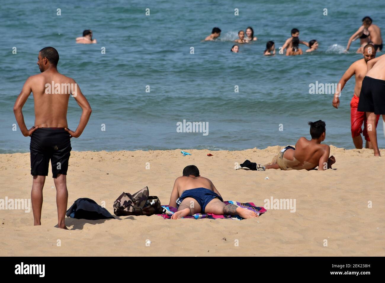 People are seen sunbathing at the La Marsa beach during the first stage of deconfinement. After ...