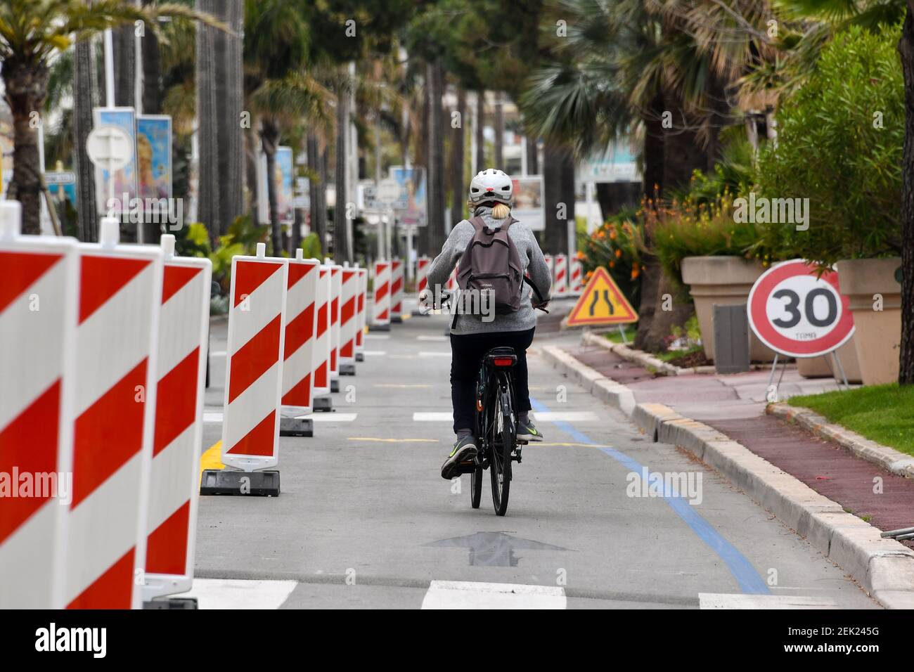 A person rides a bike in the new bike lane in Cannes, France on May 10 ...