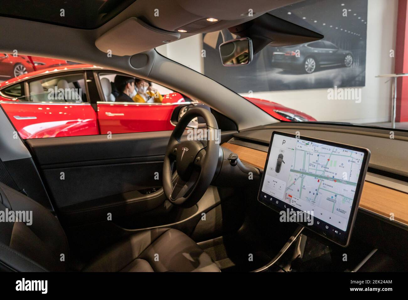SHANGHAI, CHINA - MAY 9, 2020 - Citizens watch three models of Tesla ...