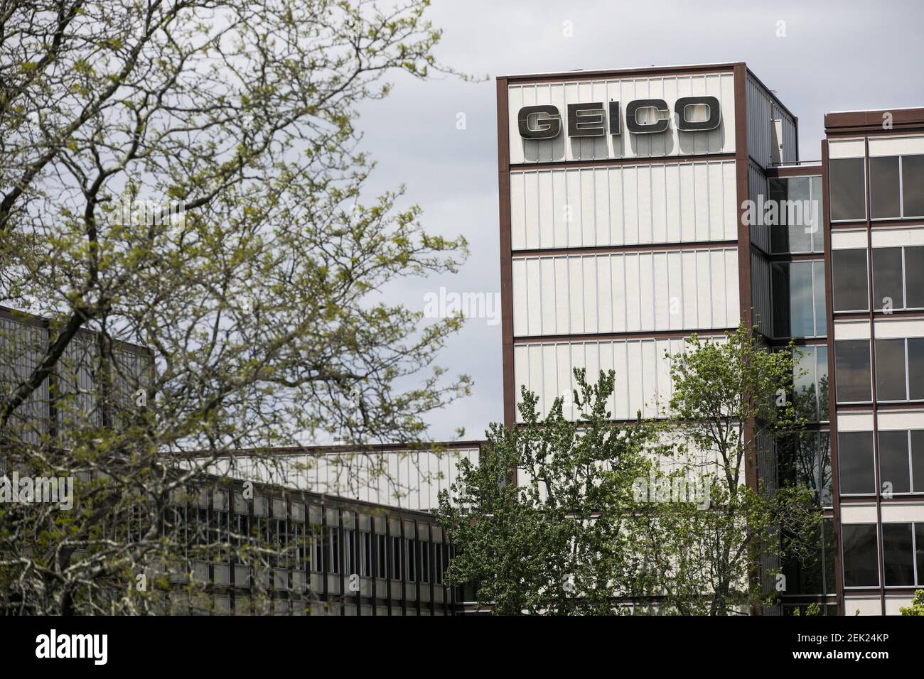 A logo sign outside of the headquarters of The Government Employees Insurance Company (GEICO) in ...