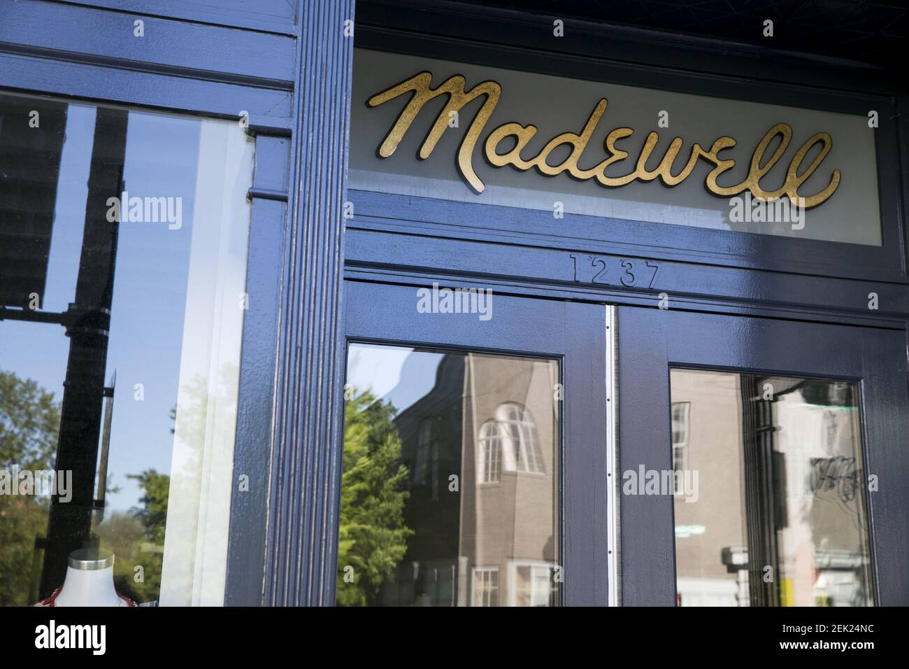 A logo sign outside of a Madewell retail store location in Washington ...