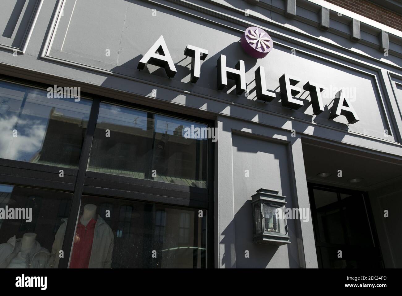 A logo sign outside of a Athleta retail store location in Washington, D ...