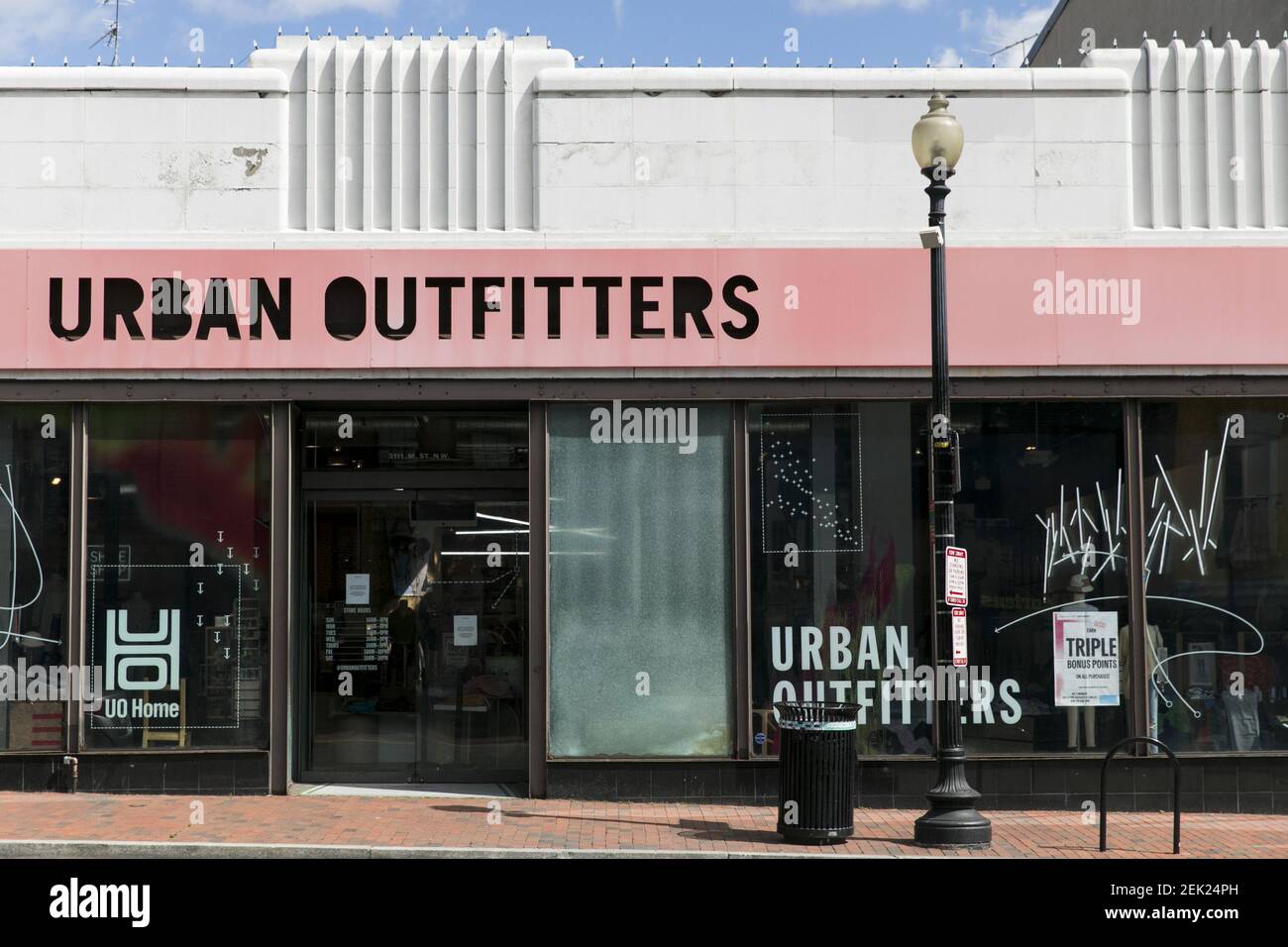 A logo sign outside of a Urban Outfitters retail store location in ...