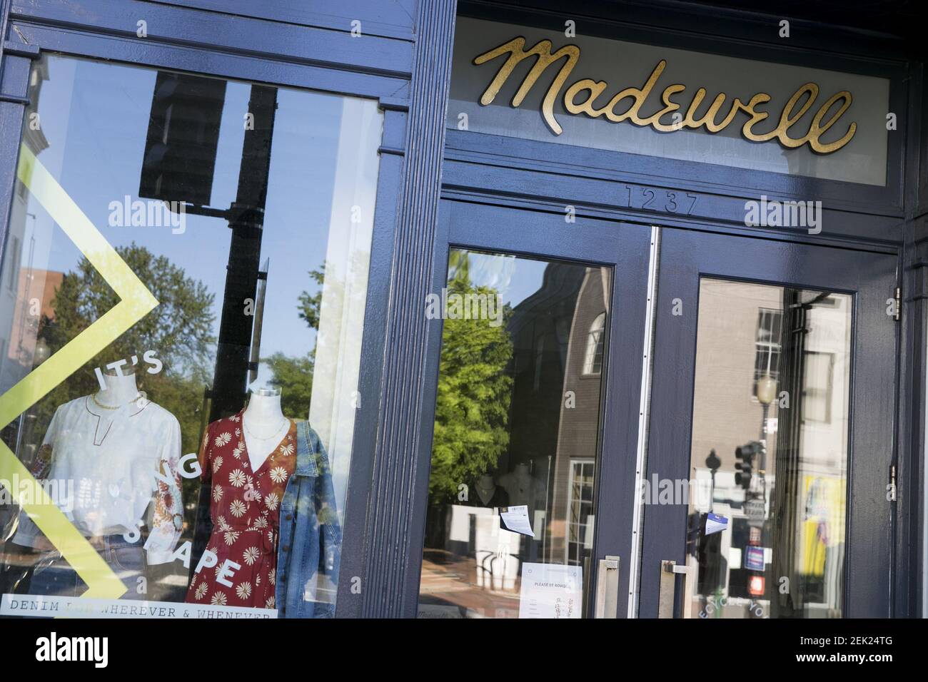 A logo sign outside of a Madewell retail store location in Washington ...