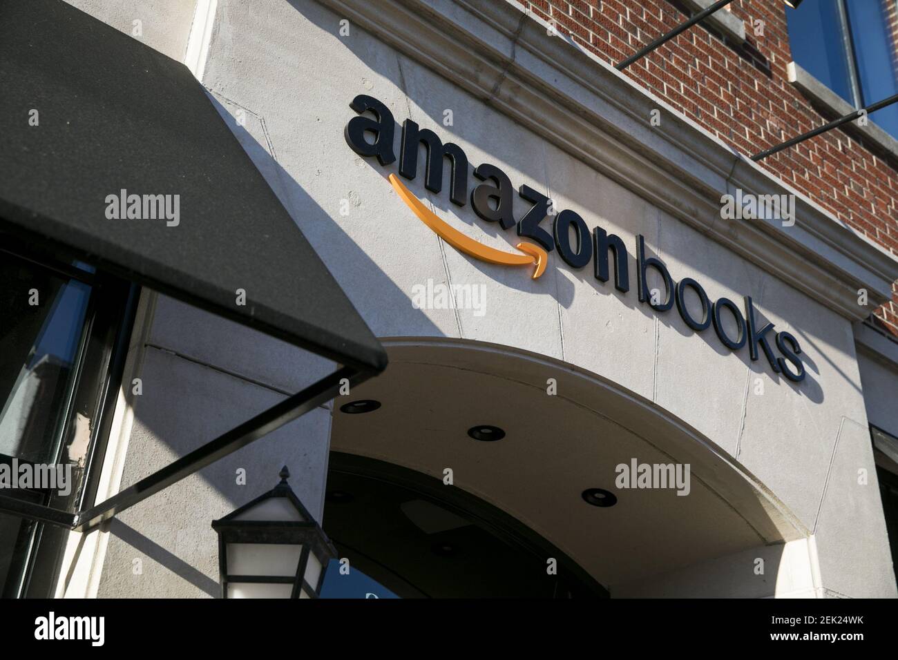 A logo sign outside of a Amazon Books retail store location in ...
