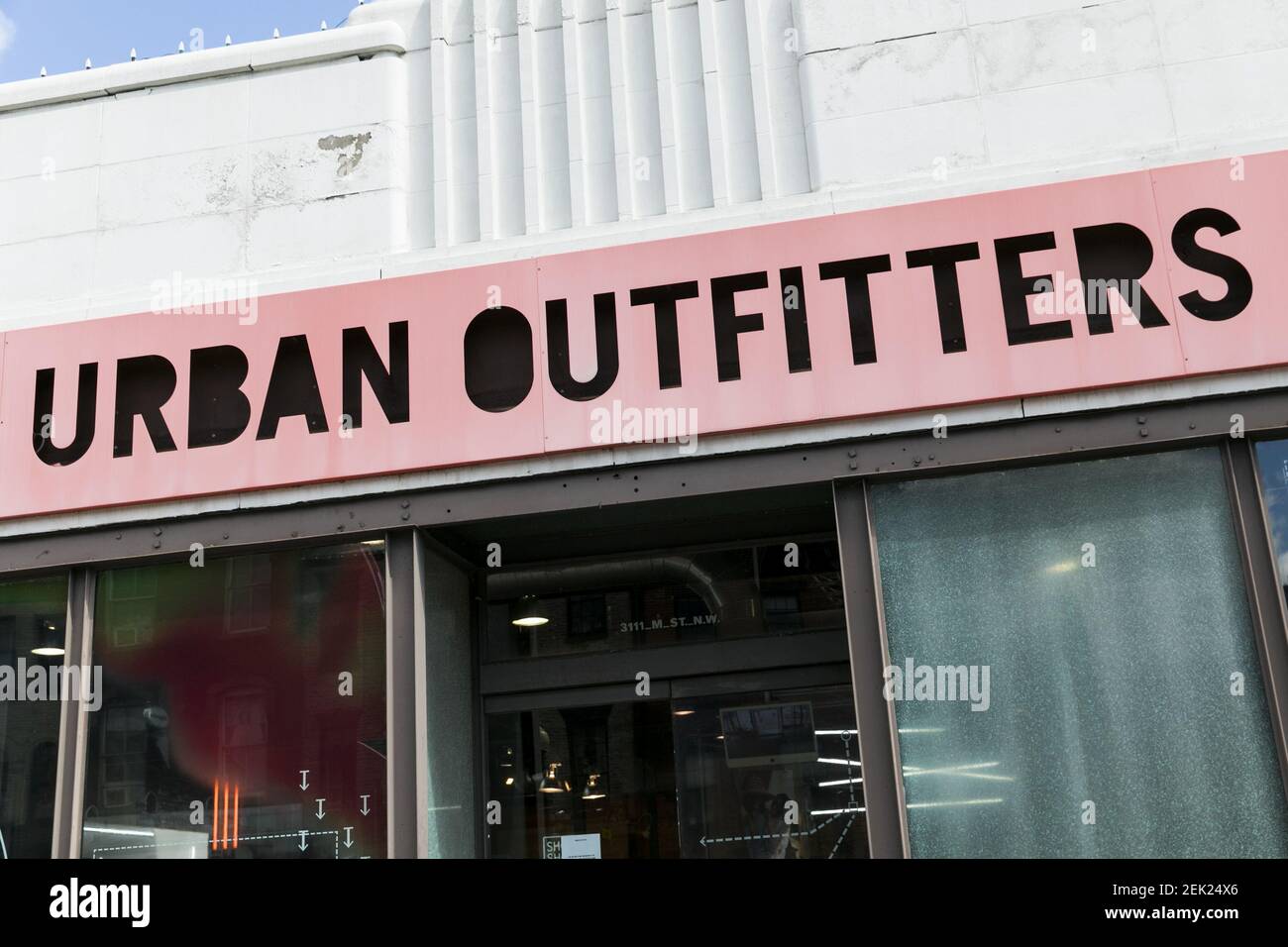 A logo sign outside of a Urban Outfitters retail store location in ...