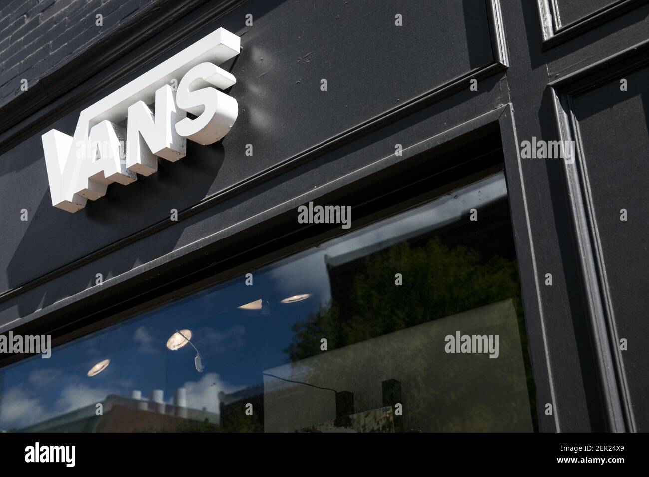 A logo sign outside of a Vans retail store location in Washington, D.C ...