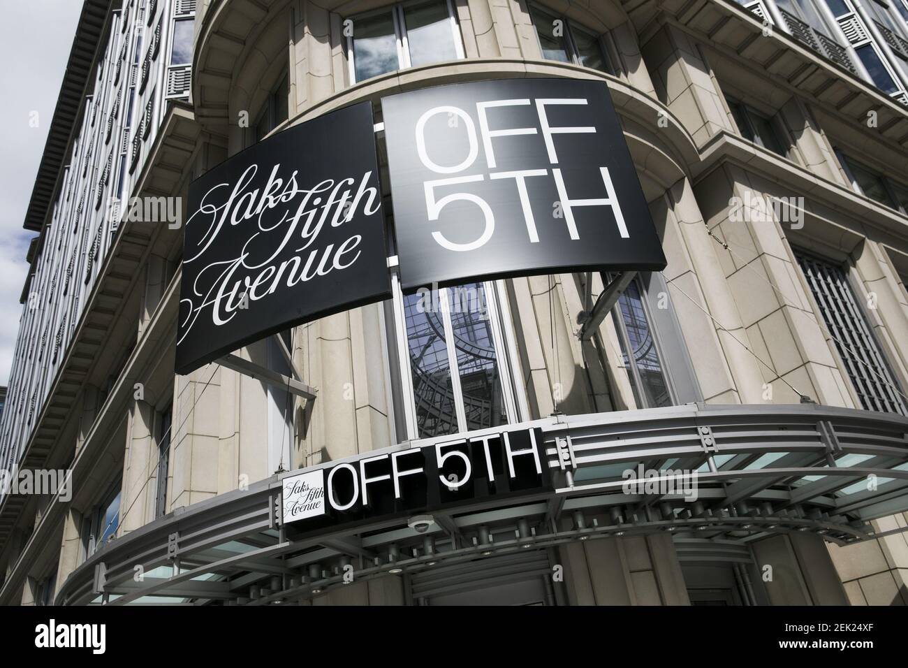 A logo sign outside of a Saks Fifth Avenue Saks Off 5th retail store ...