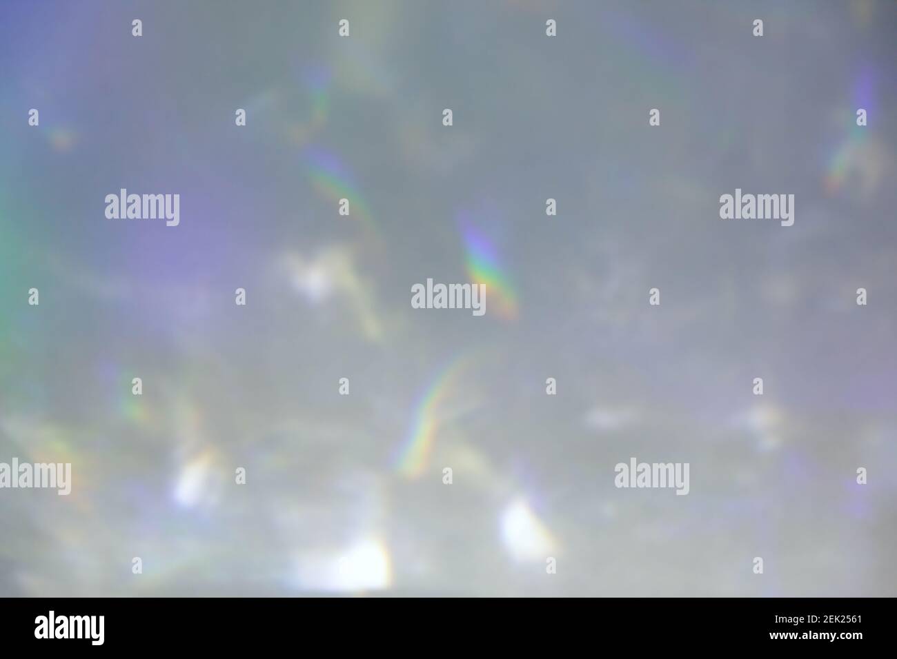Blurred rainbow light refraction texture on white wall Stock Photo - Alamy