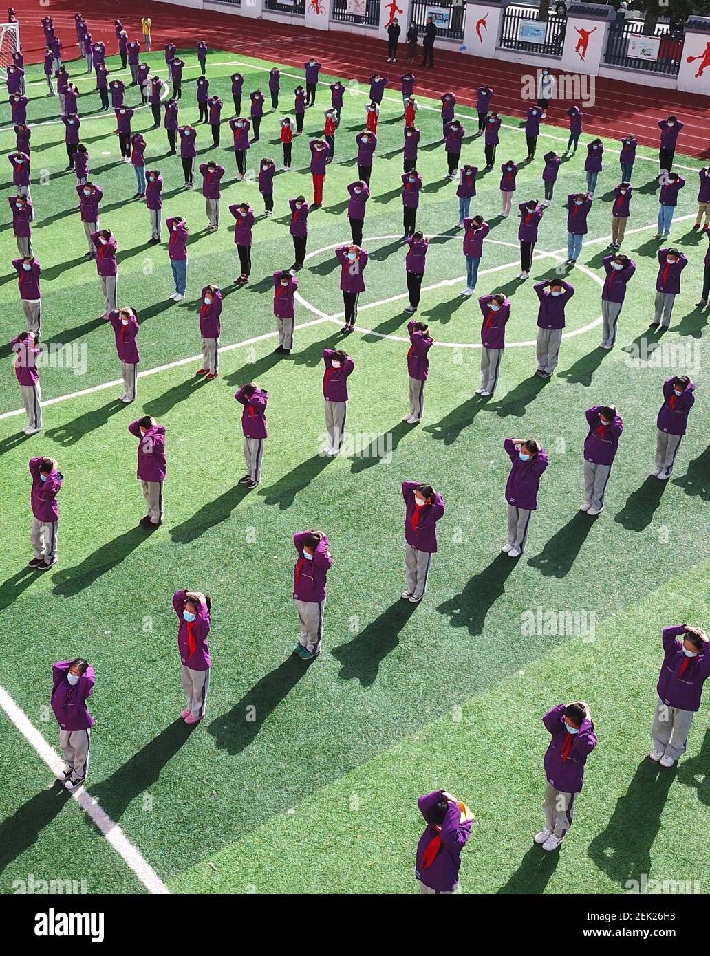 An aerial view of primary school students conducting safety drill in ...