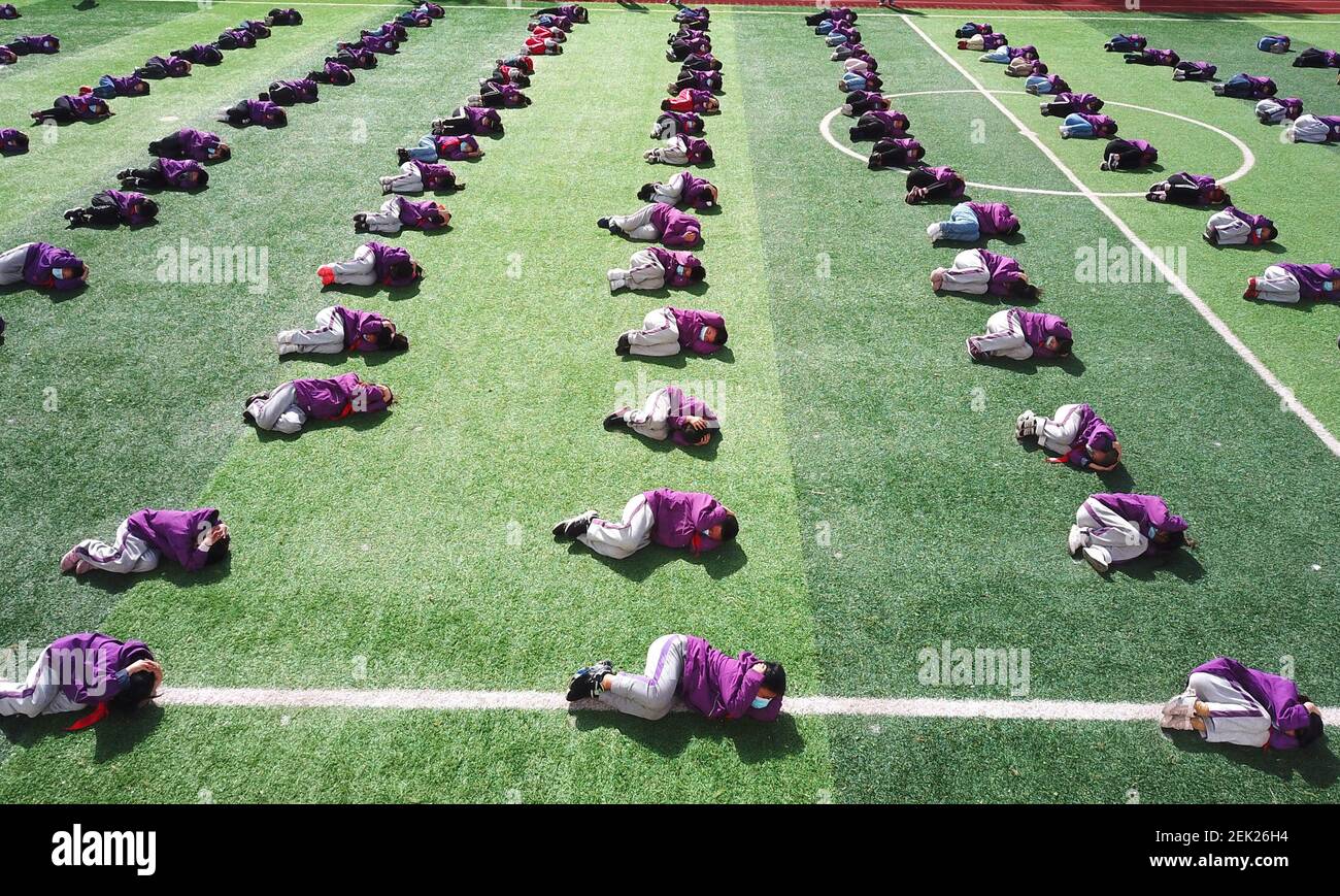 An aerial view of primary school students conducting safety drill in ...