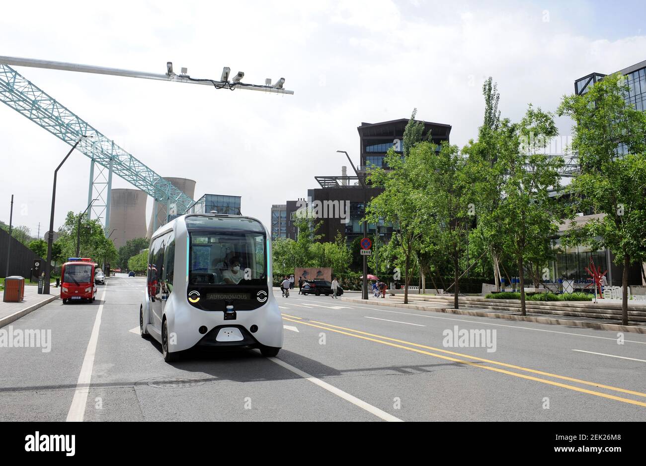 Unmanned buses operate at Shougang Yuan in Beijing, China, 11 May 2020. (Photo by Qianlong Wang ...