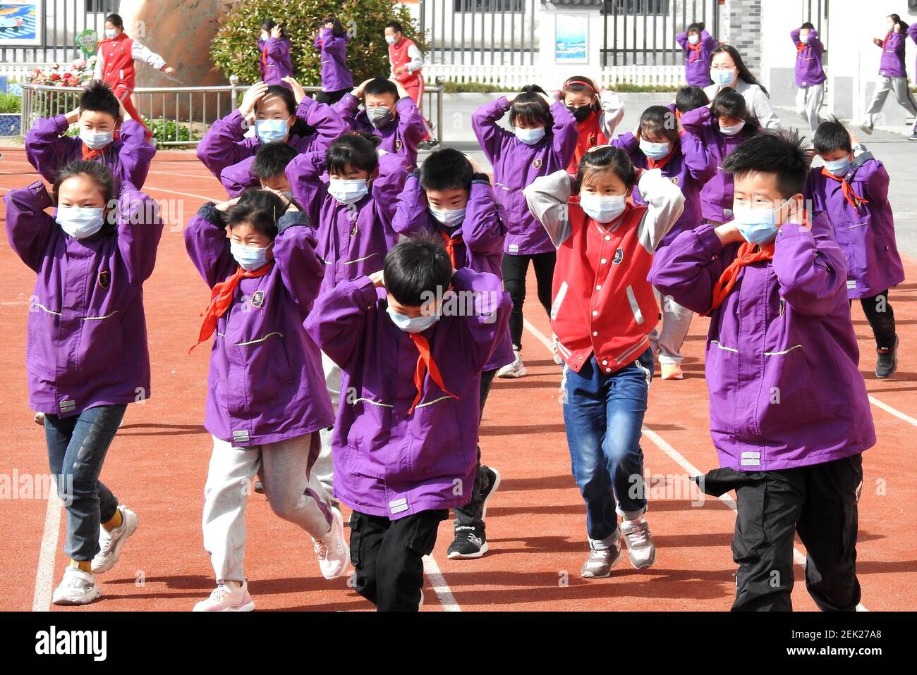Primary school students conduct safety drill in the campus during China ...