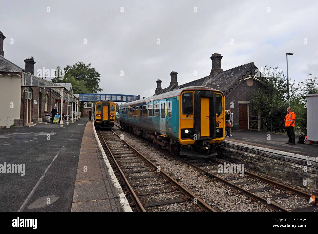 Passengers getting on Class 153 DMU trains at LLandrindod Wells Station ...