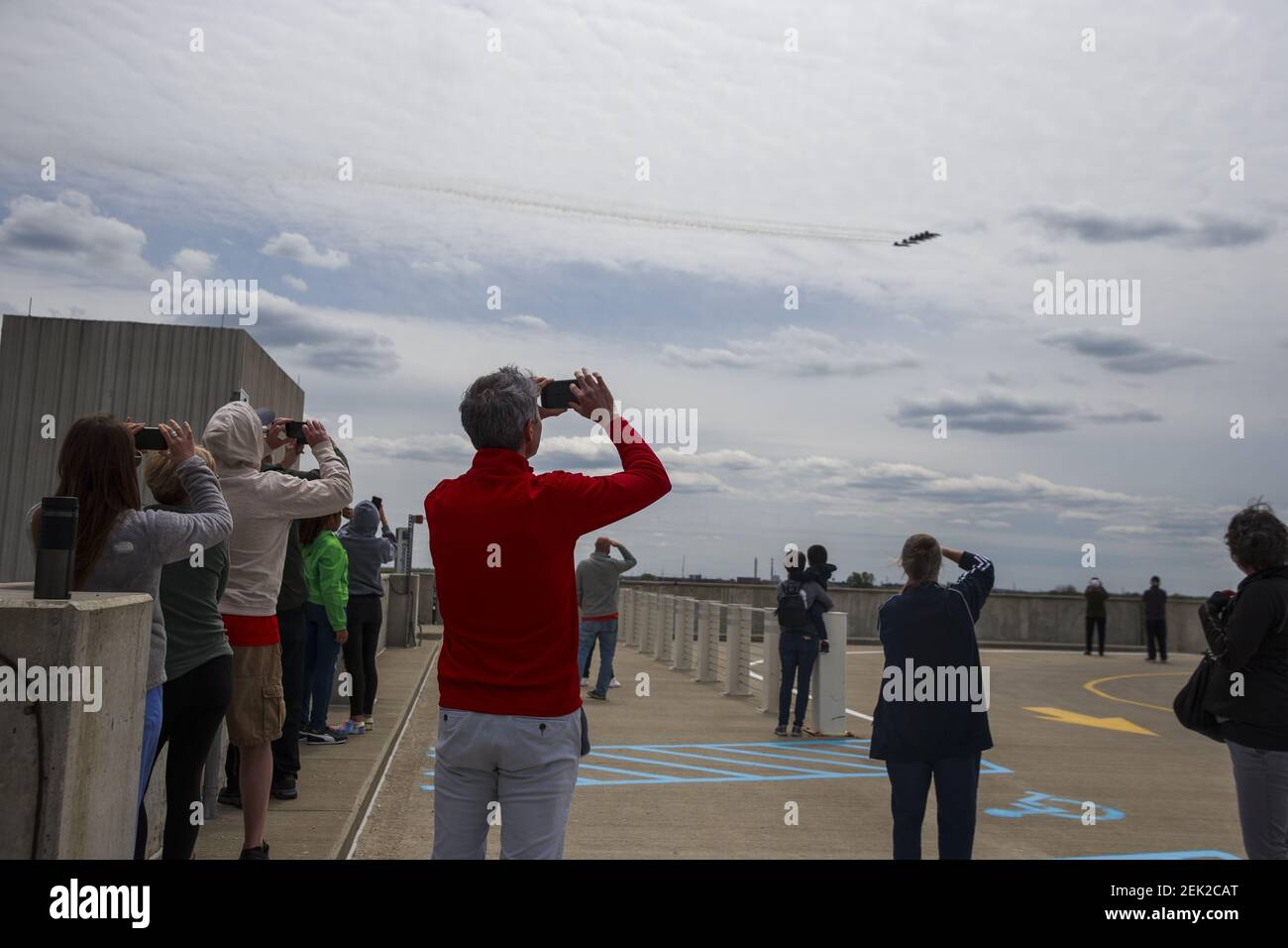 Spectators watch the United States Navy Blue Angels flying over ...