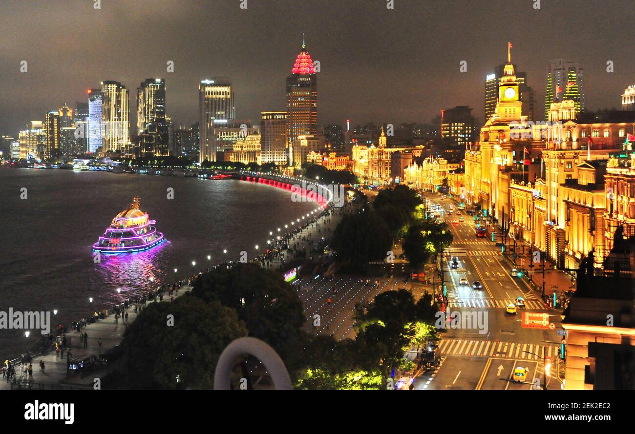 The night view of skyscrapers at the Bund along the Huangpu River ...