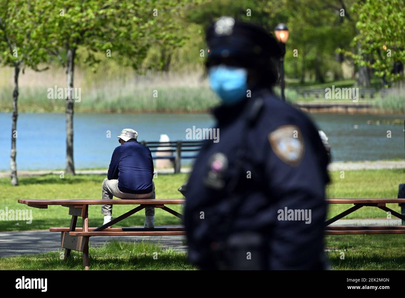 An Nypd School Safety Officer Patrols Baisely Pond Park Enforcing Social Distancing Rules During