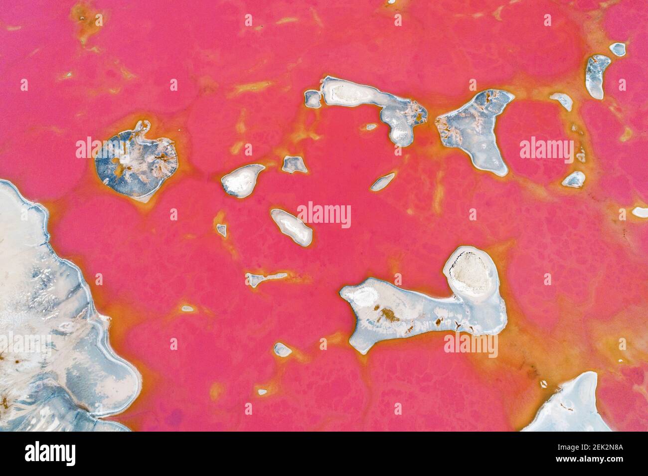 Aerial view of a ruby lake, the Geletu lake in the Badain Jaran Desert ...