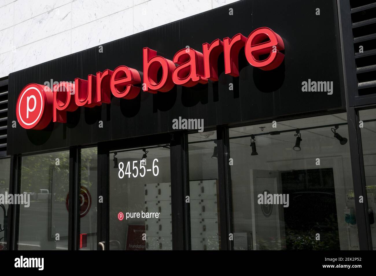 A logo sign outside of a Pure Barre location in Silver Spring, Maryland ...