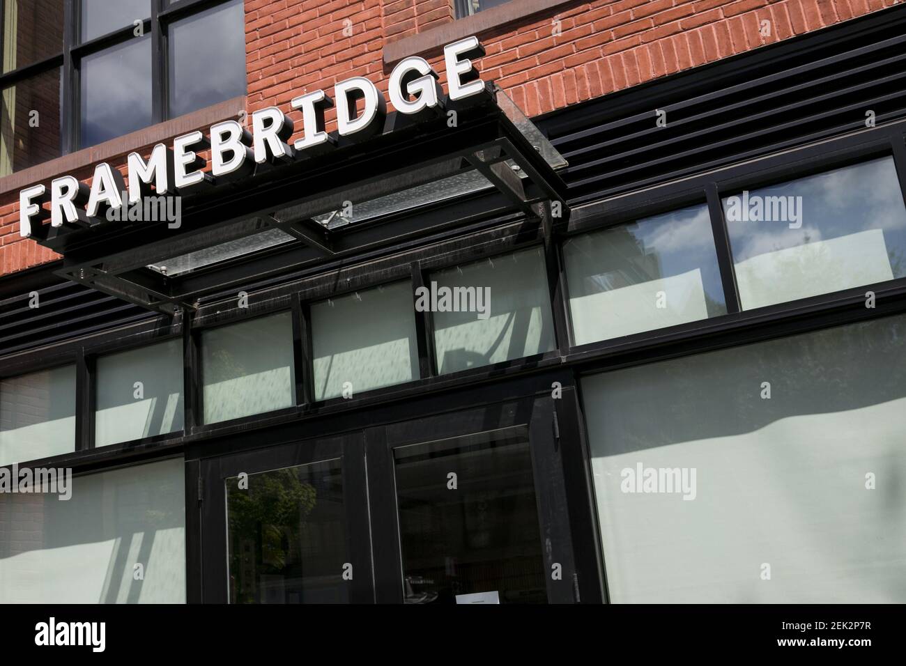 A logo sign outside of a Framebridge store location in Washington, D.C ...