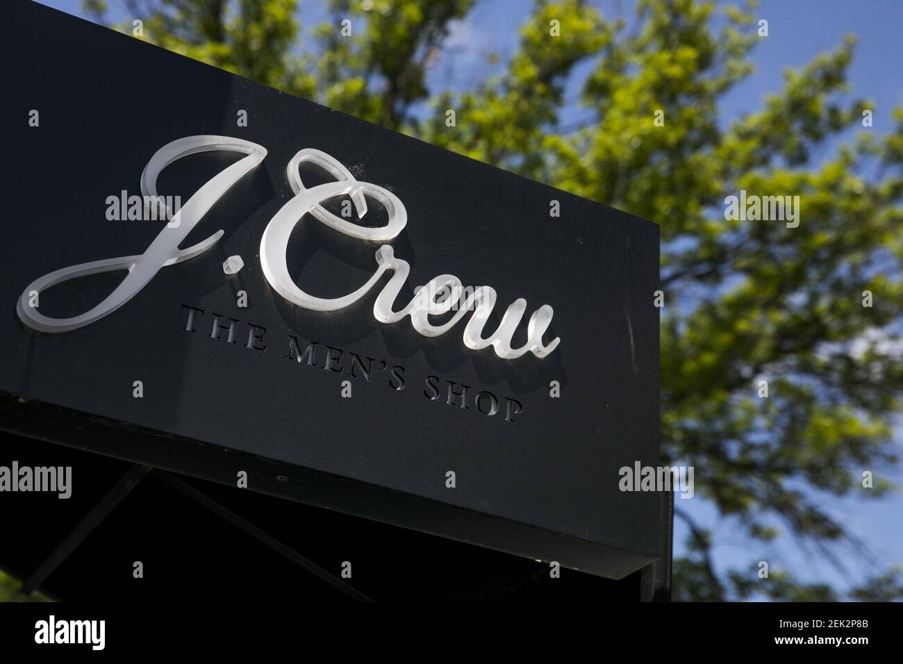 A logo sign outside of a J.Crew The Men's Shop retail store location in ...