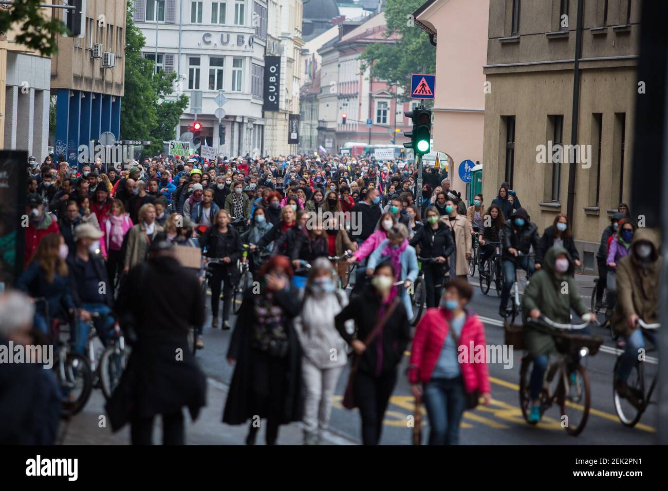 Protesters wearing face masks as a preventive measure march on the ...