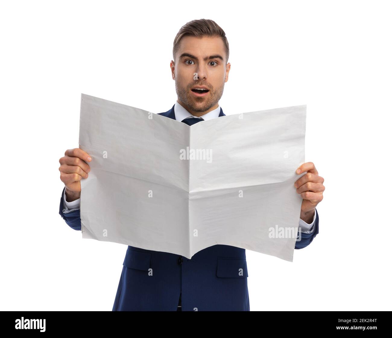surprised unshaved businessman in elegant navy blue suit reading ...