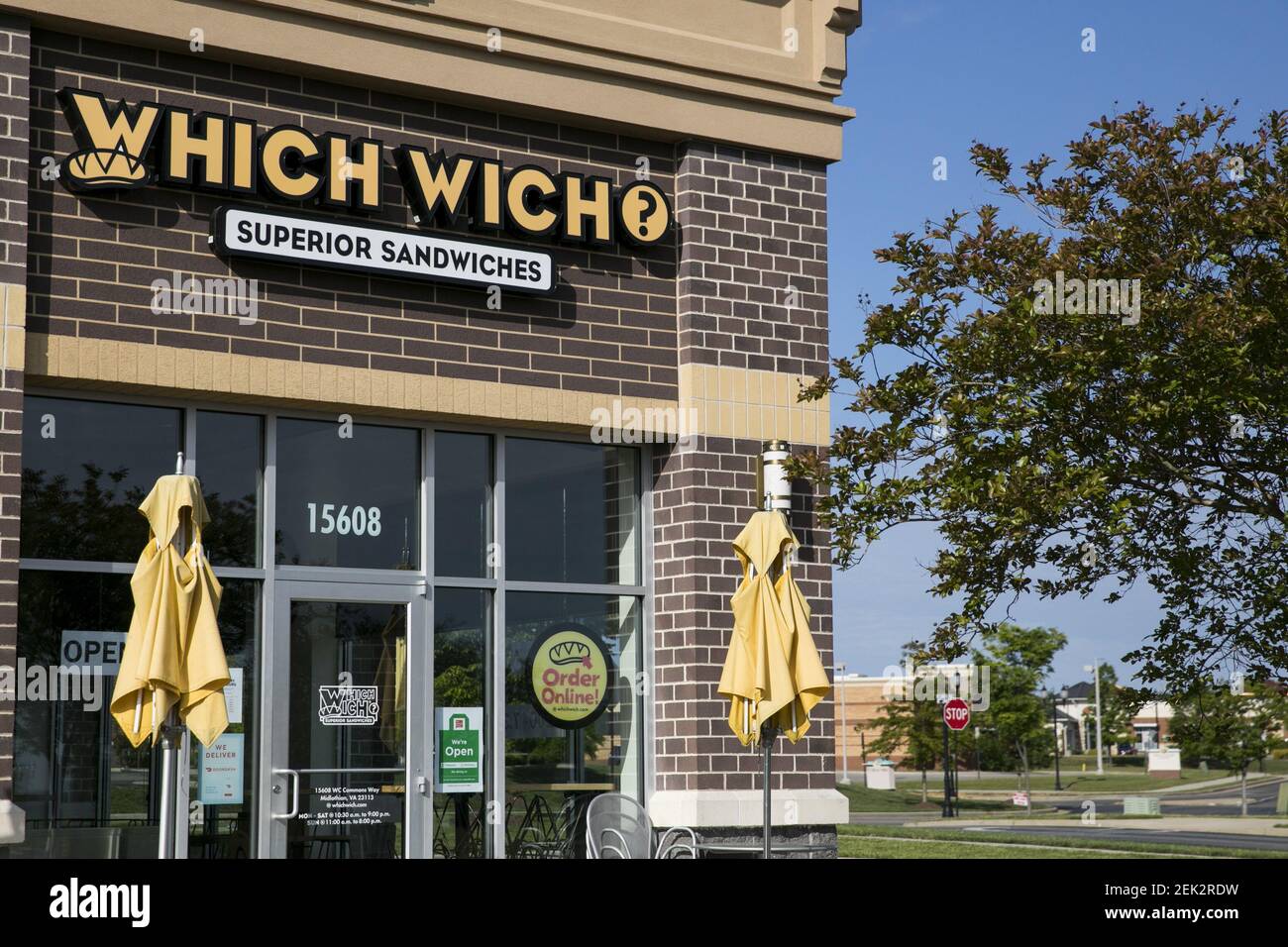 A logo sign outside of a Which Wich Superior Sandwiches restaurant ...