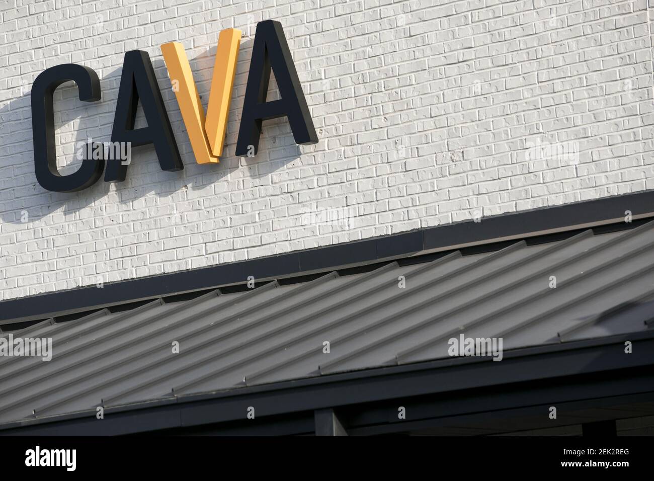 A logo sign outside of a Cava restaurant location in Richmond, Virginia ...