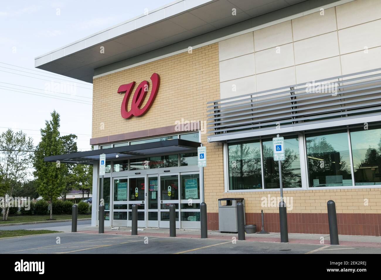 A logo sign outside of a Walgreens Pharmacy store location in Richmond ...