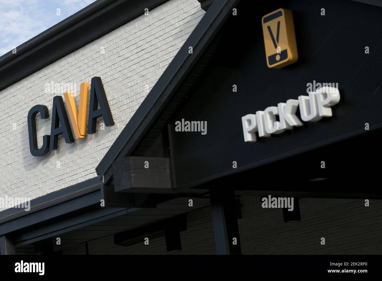 A logo sign outside of a Cava restaurant location in Richmond, Virginia ...