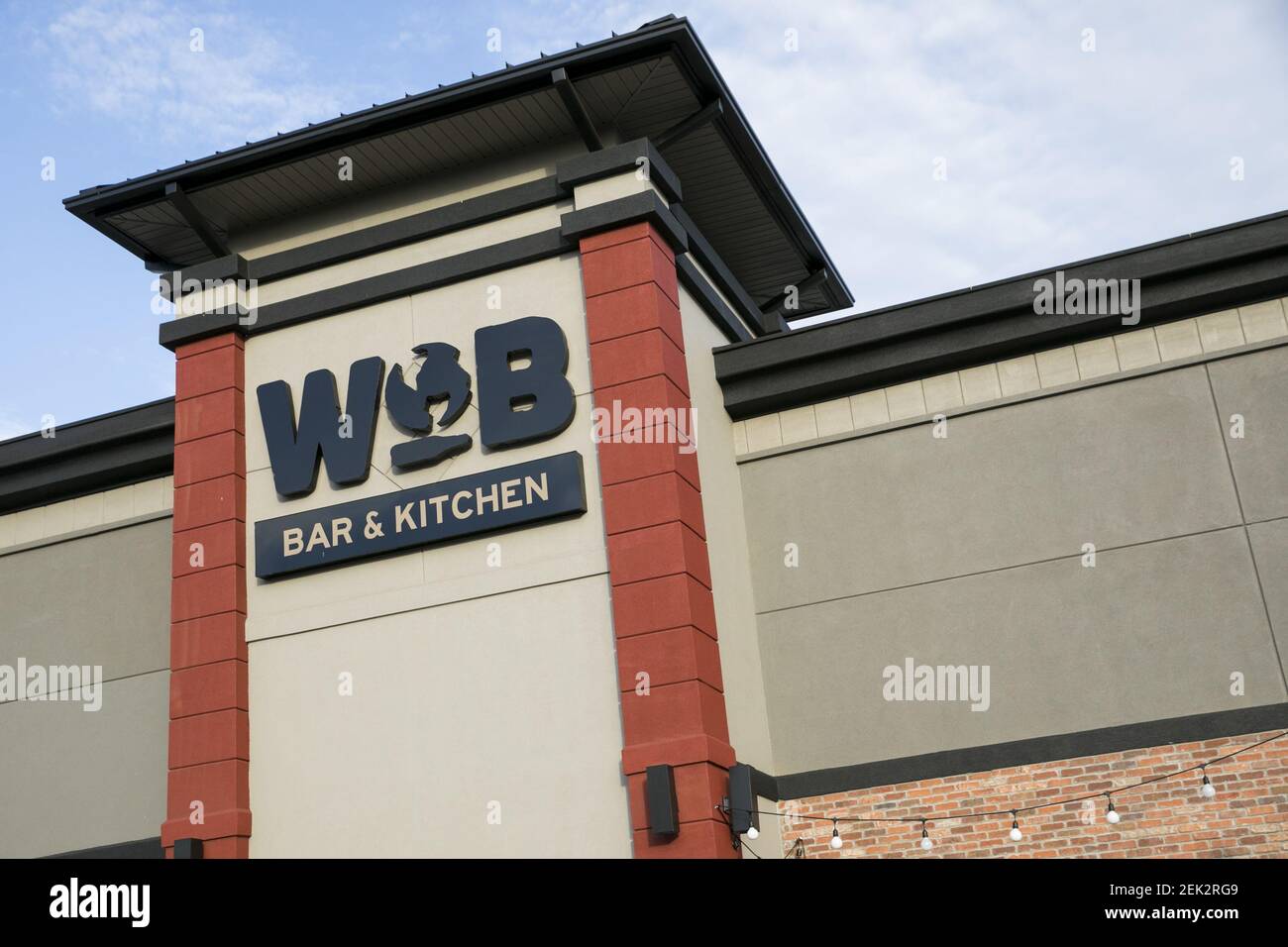 A logo sign outside of a World of Beer (WOB) restaurant location in ...
