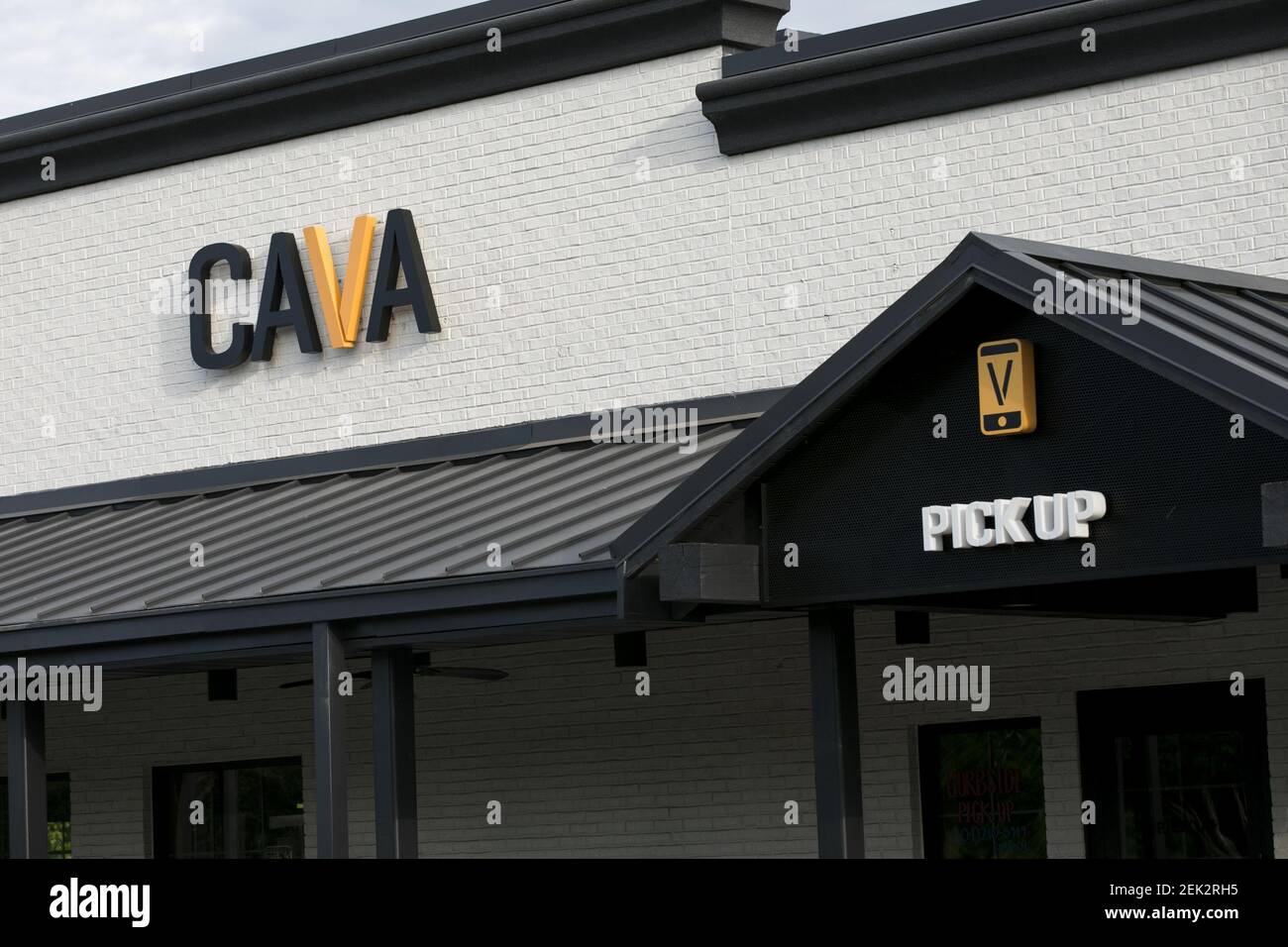 A logo sign outside of a Cava restaurant location in Richmond, Virginia ...
