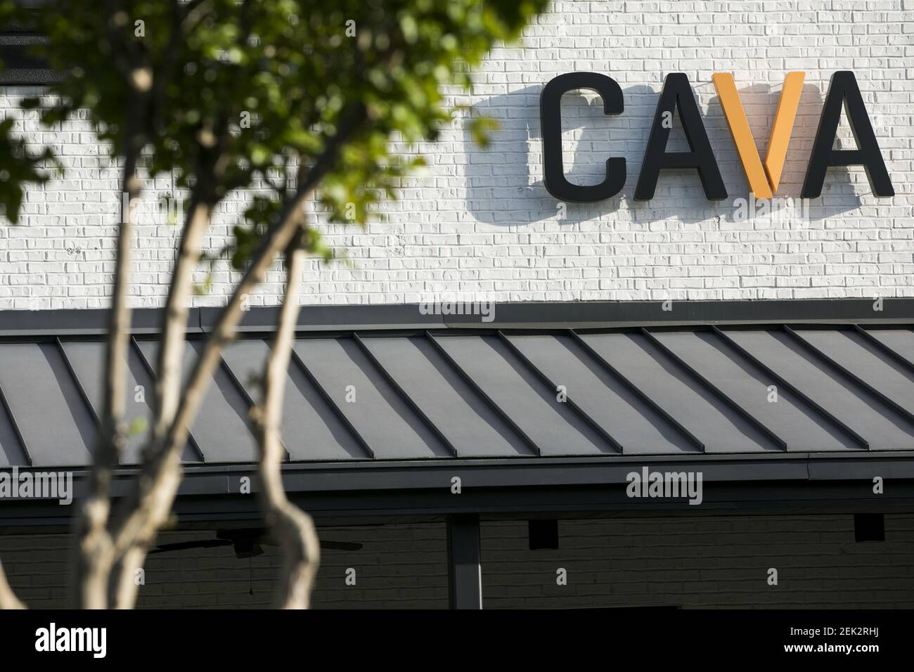 A logo sign outside of a Cava restaurant location in Richmond, Virginia ...