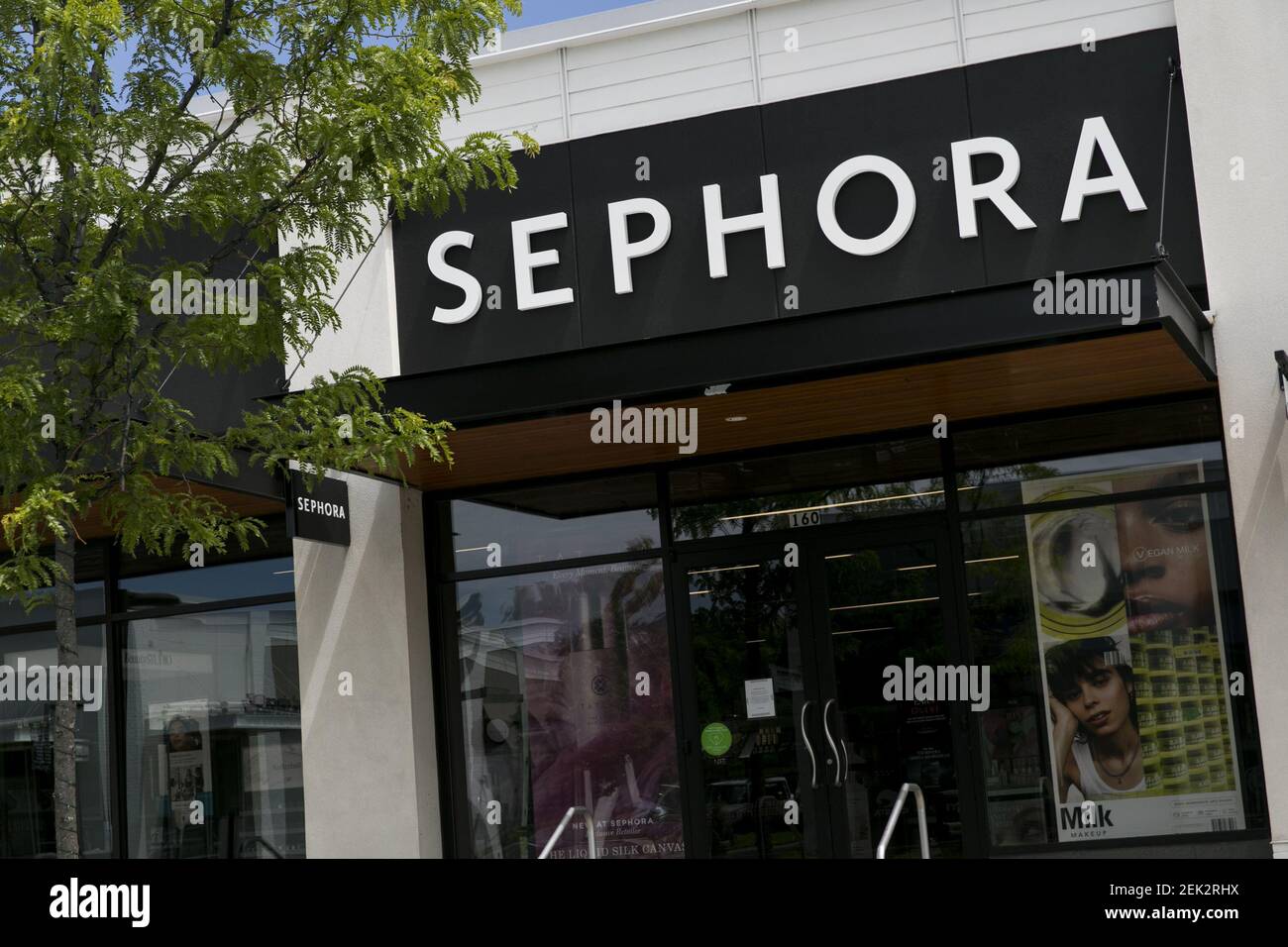 A logo sign outside of a Sephora retail store location in ...