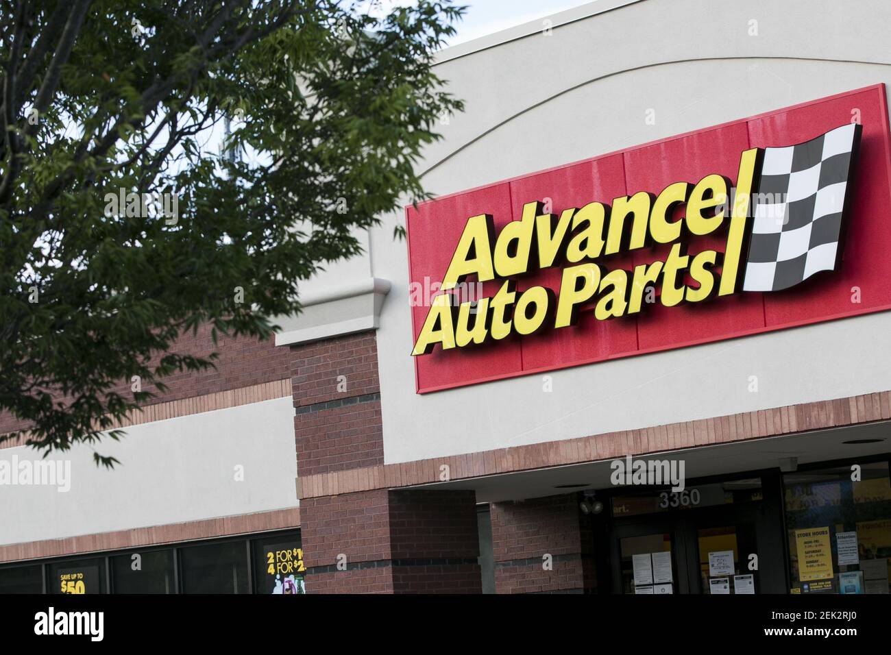 A logo sign outside of a Advance Auto Parts retail store location in ...
