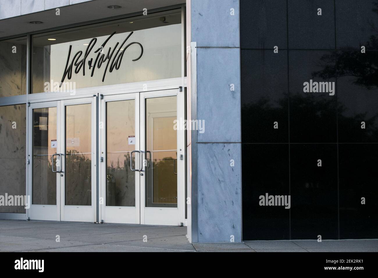 A logo sign outside of a Lord & Taylor retail store location in ...