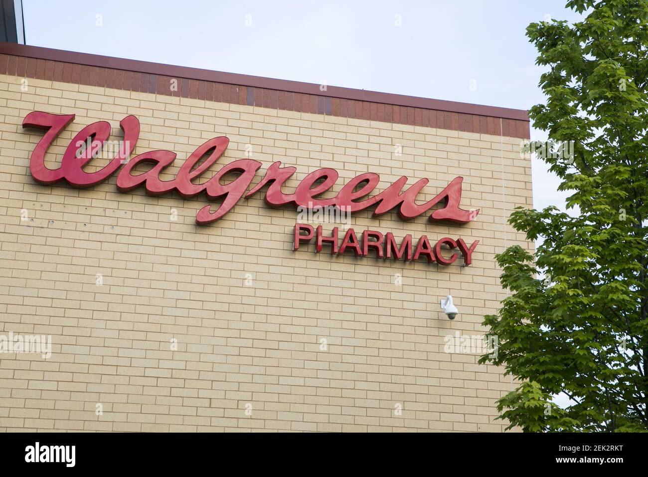 A logo sign outside of a Walgreens Pharmacy store location in Richmond ...
