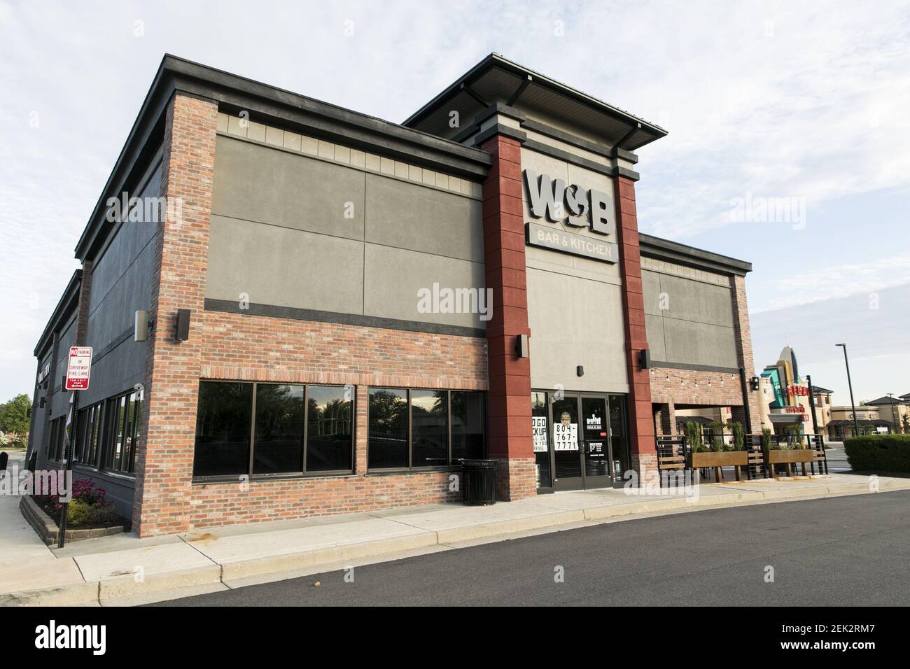 A logo sign outside of a World of Beer (WOB) restaurant location in ...