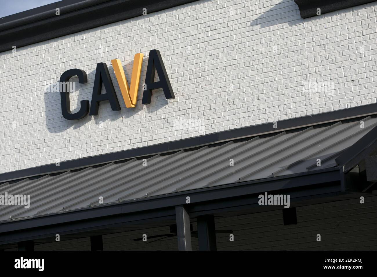 A logo sign outside of a Cava restaurant location in Richmond, Virginia ...