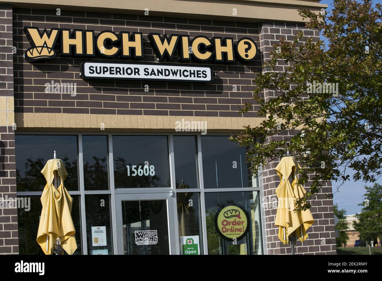 A logo sign outside of a Which Wich Superior Sandwiches restaurant ...