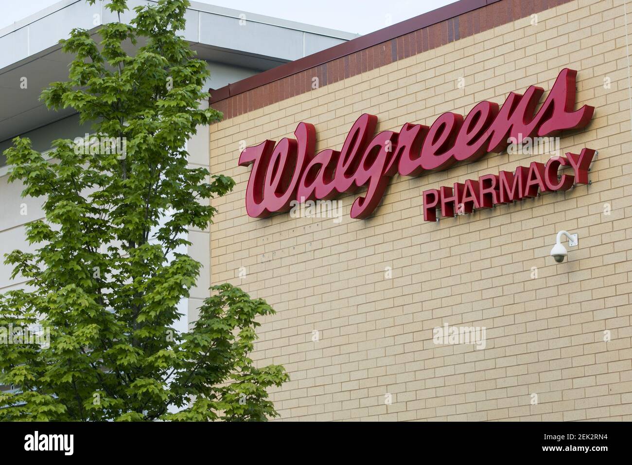 A logo sign outside of a Walgreens Pharmacy store location in Richmond ...