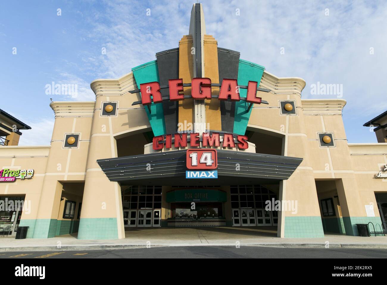 A logo sign outside of a Regal Cinemas movie theater location in ...