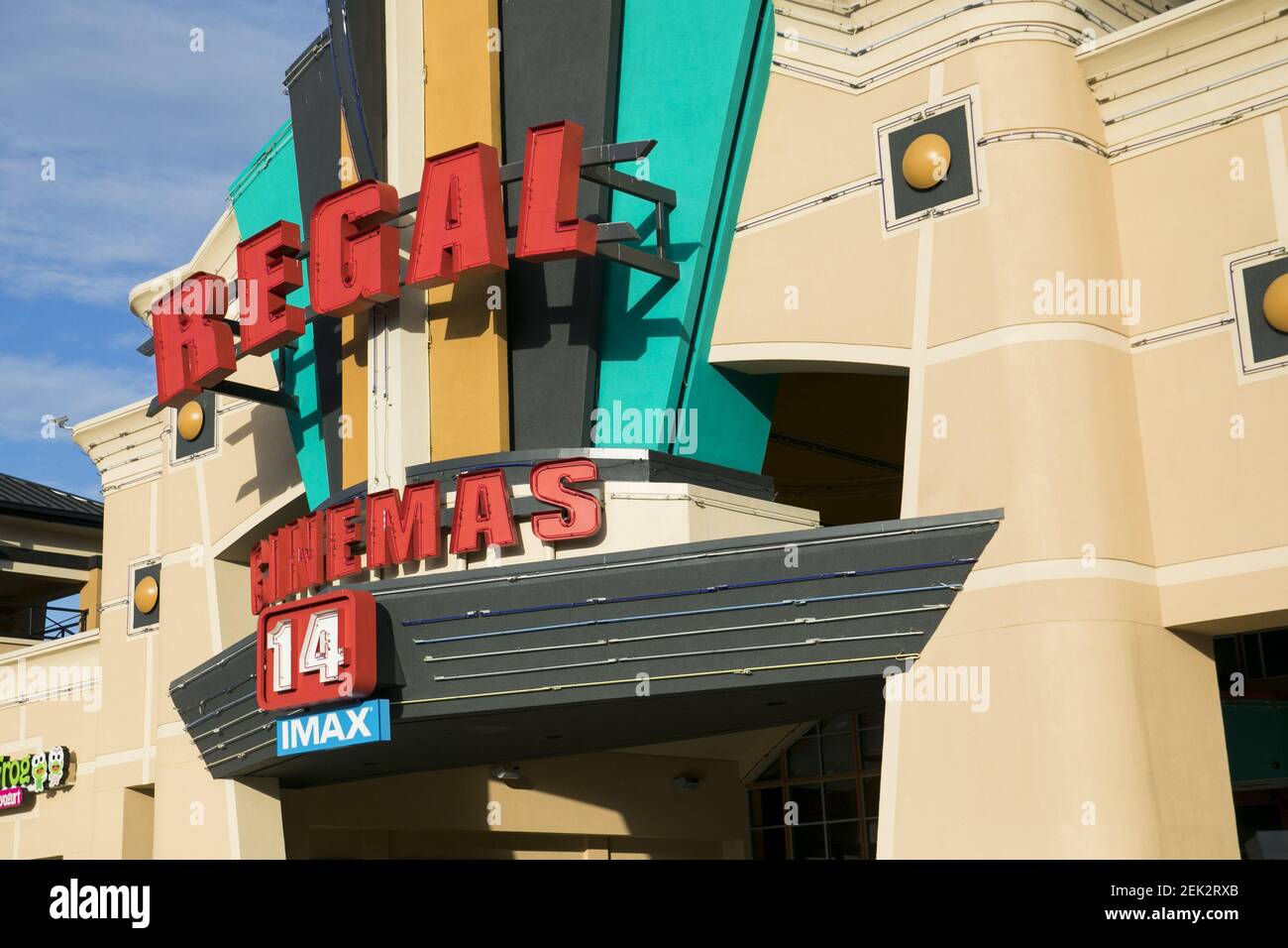 A logo sign outside of a Regal Cinemas movie theater location in ...